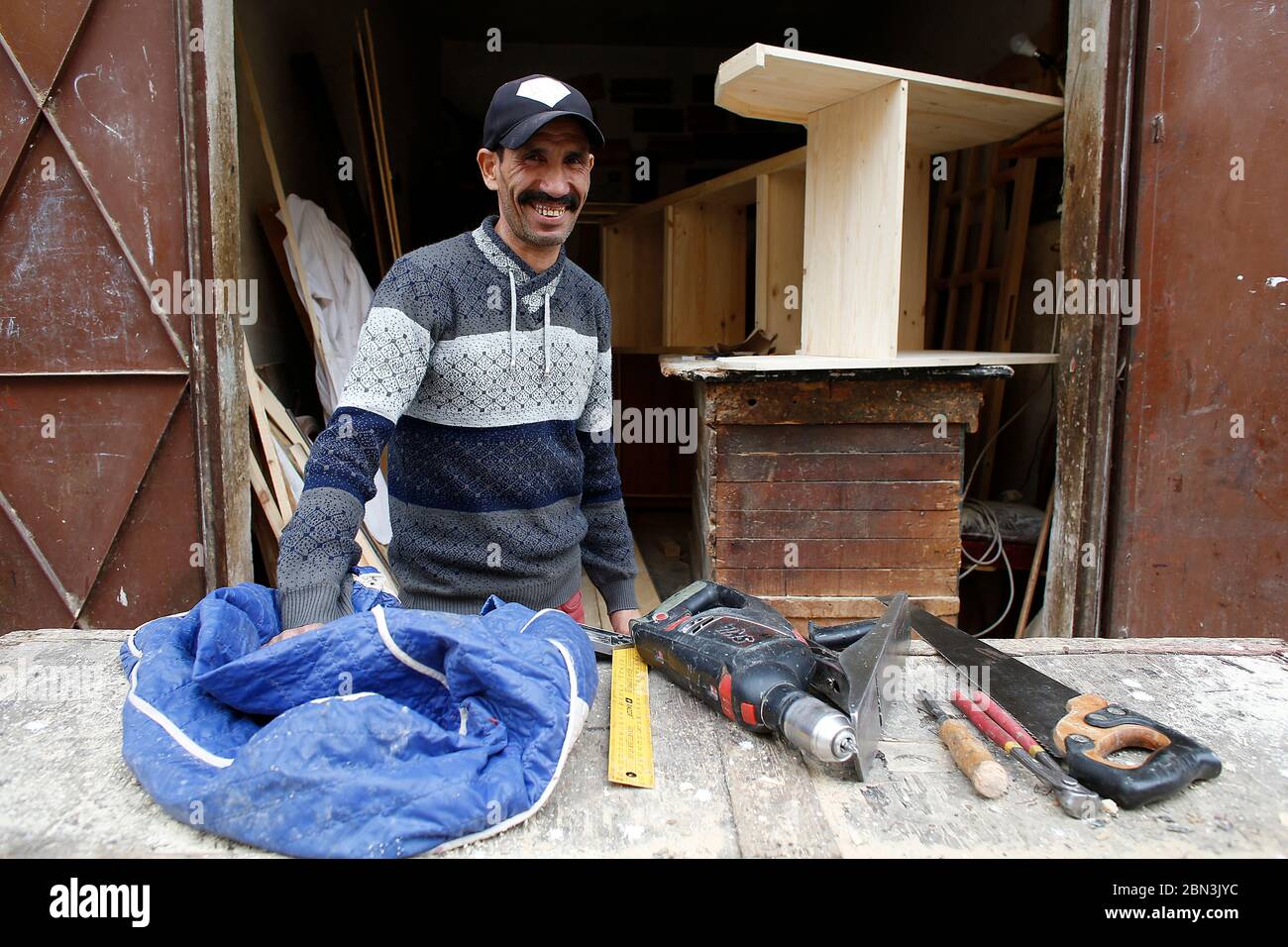 Carpenter outside his workshop in Fes, Morocco Stock Photo - Alamy