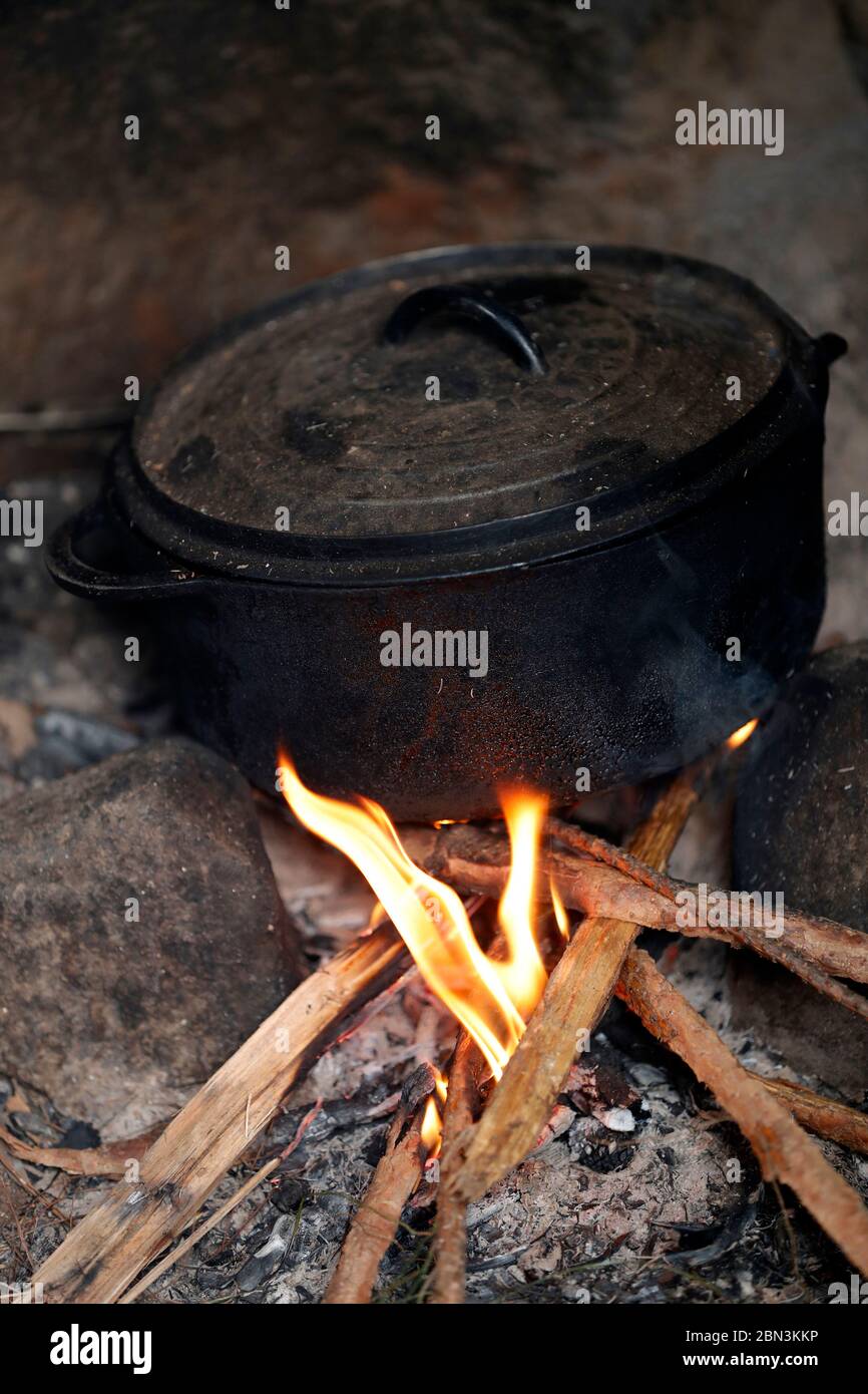African meal cooking over a fire. Madagascar Stock Photo - Alamy