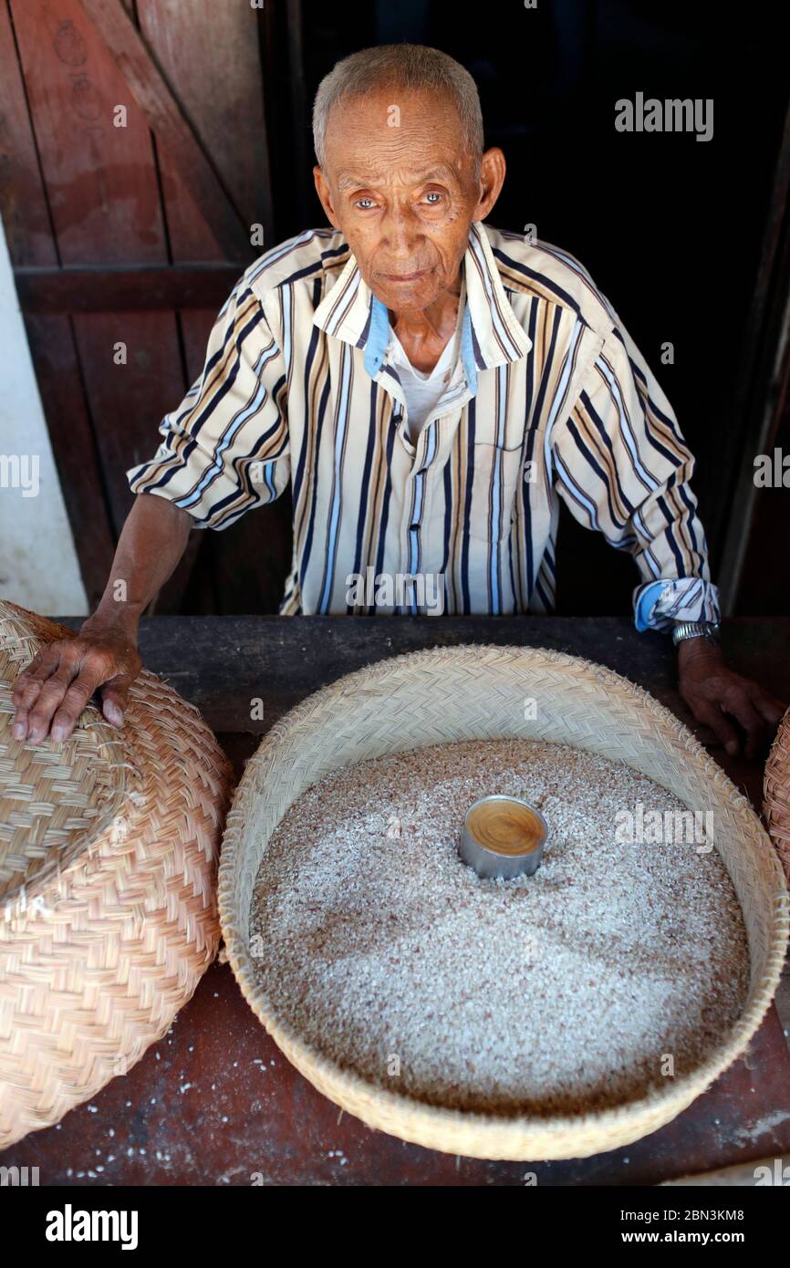 Old man selling rice at market. Madagascar Stock Photo - Alamy