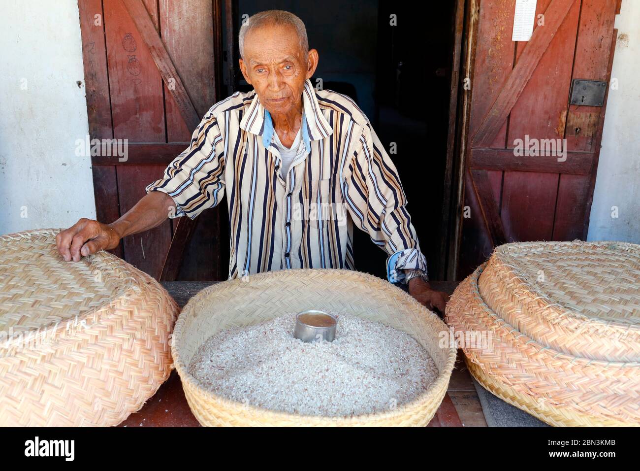 Old man selling rice at market. Madagascar Stock Photo - Alamy