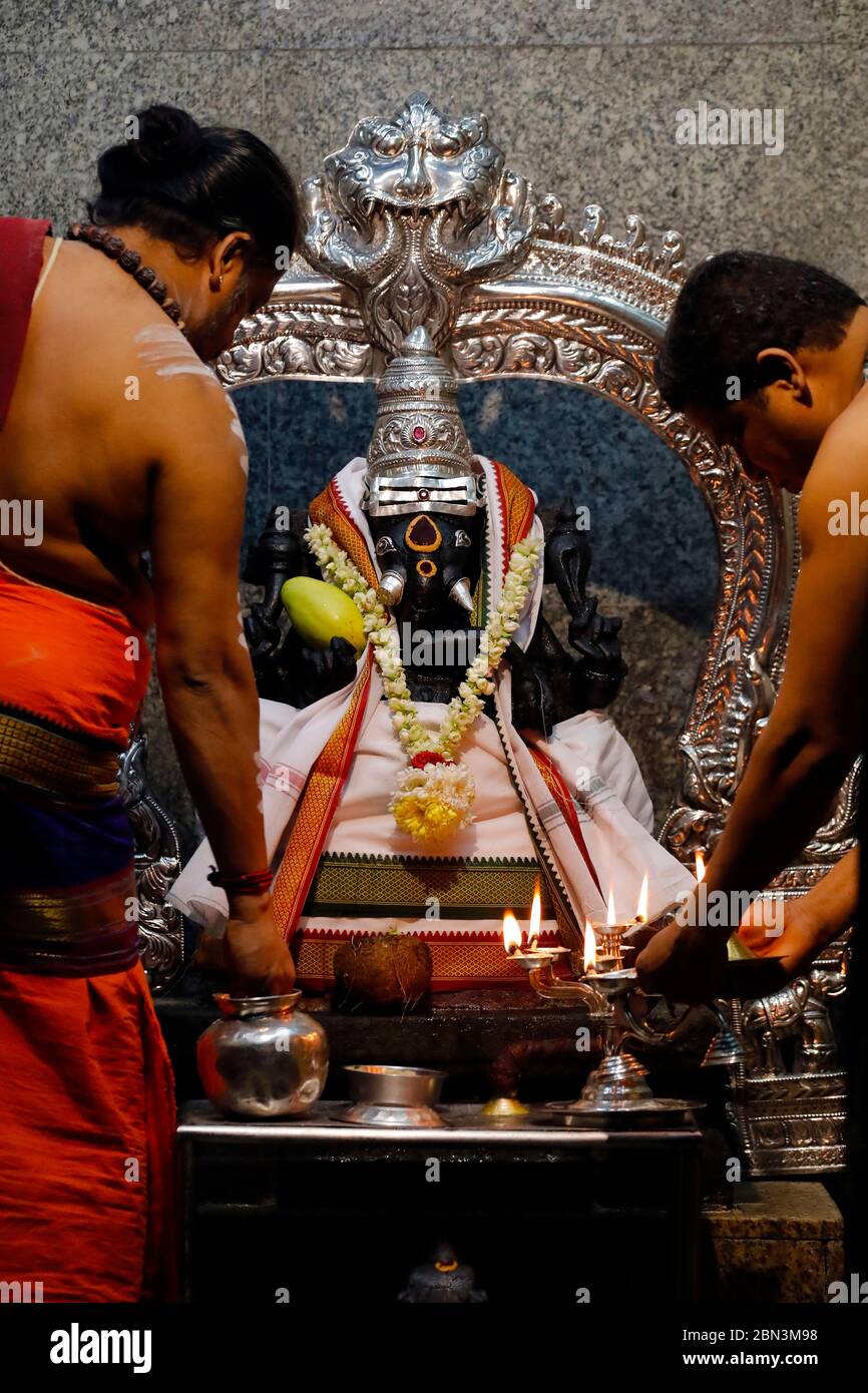 Sri Mahamariamman Hindu Temple. Hindu priests doing puja worship. Kuala ...