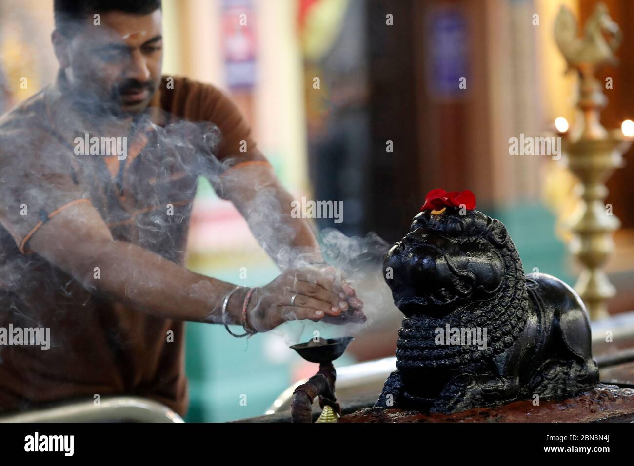 Sri Mahamariamman Hindu Temple. Man praying in temple. Kuala Lumpur ...