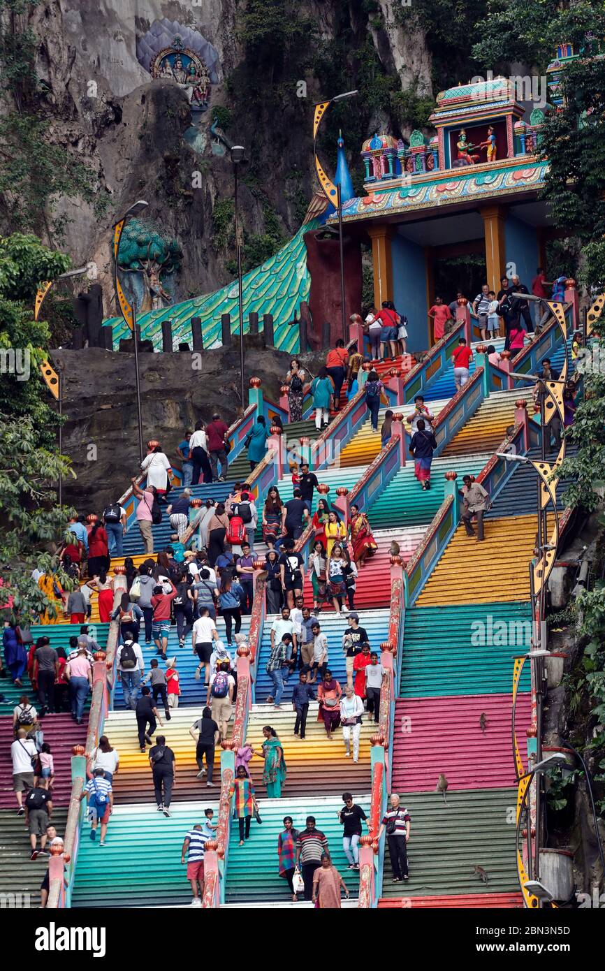 Hindu temple and shrine of Batu Caves. Entrance through the colorful ...