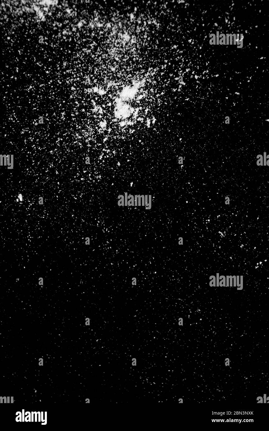 Unknown white powder isolated on black background Stock Photo - Alamy