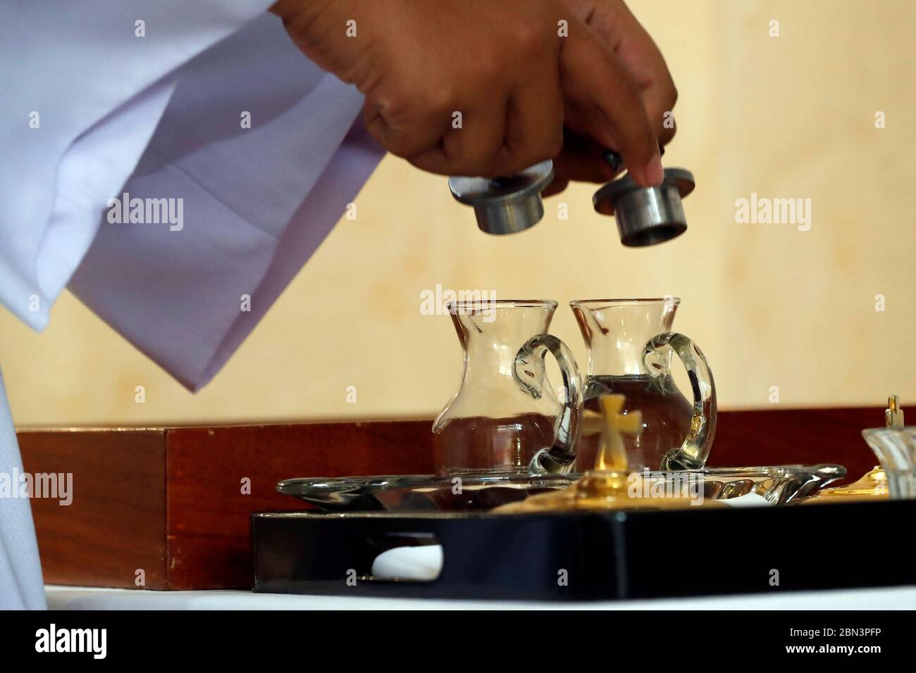 Catholic church. Sunday mass. Eucharist table. Altar servant. Ho Chi ...