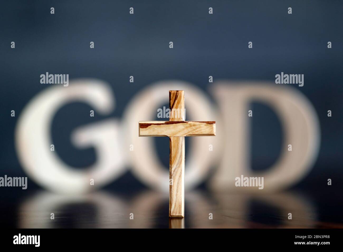 Wooden letters forming the word GOD and cross. Christian symbol Stock ...