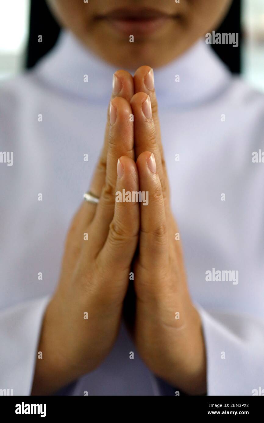 Dominican nun paying. Vietnam Stock Photo - Alamy