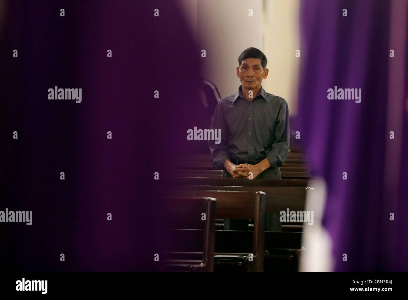 Catholic mass. Priests wearing purple roman chasuble. Quy Nhon. Vietnam ...