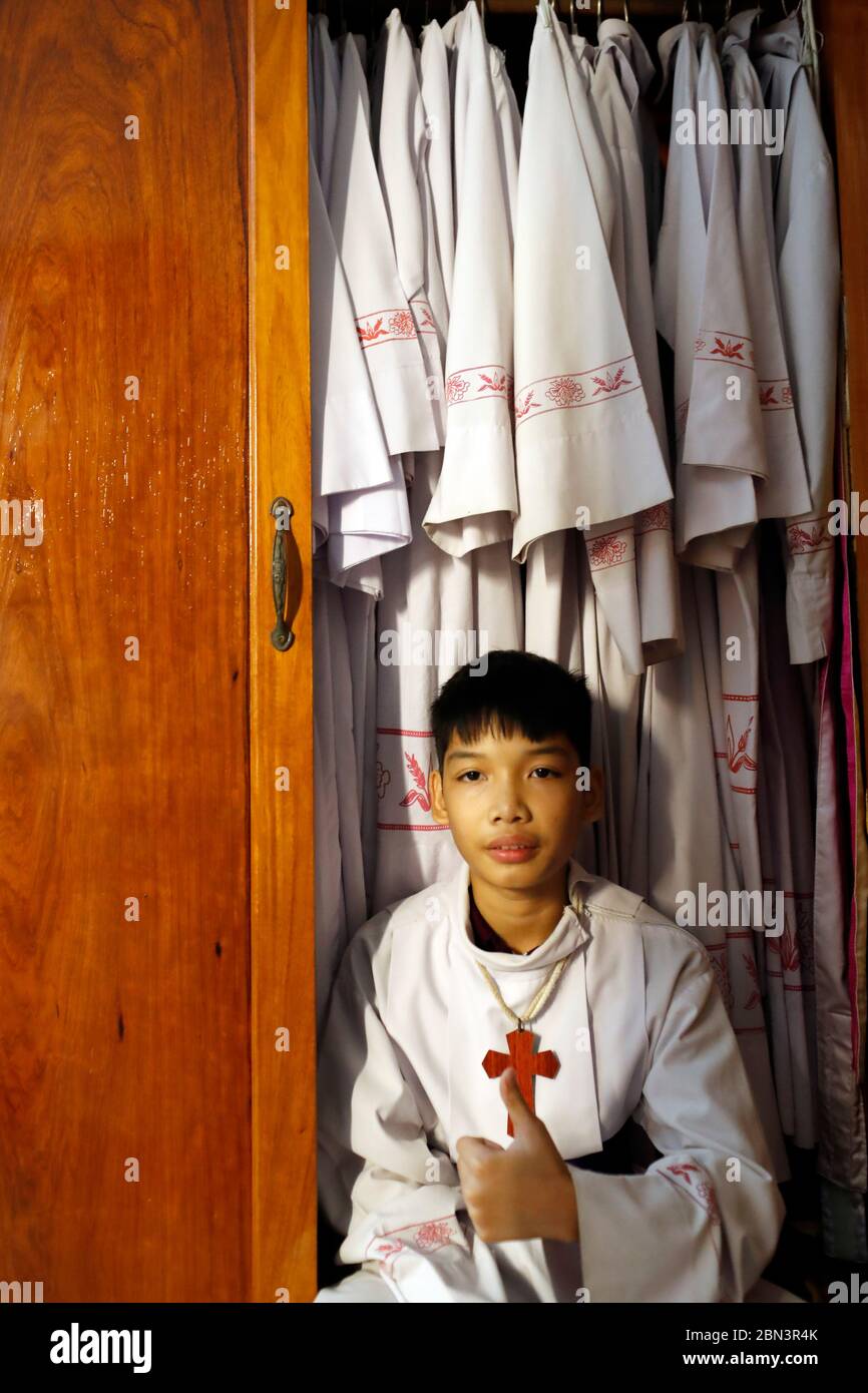 Catholic church. Altar boy in sacristy. Quy Nhon. Vietnam Stock Photo ...