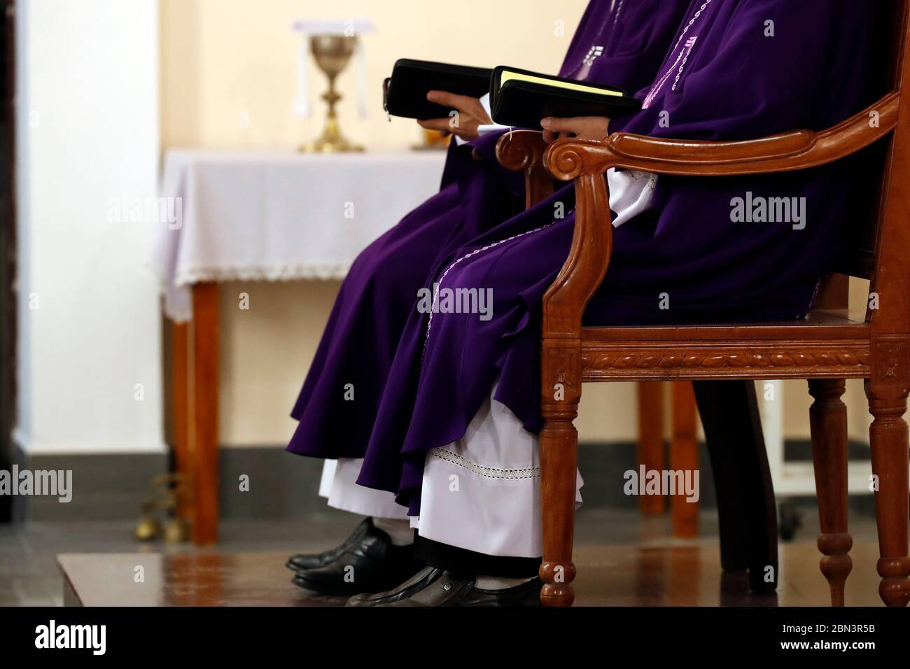 Catholic mass. Priests wearing purple roman chasuble. Quy Nhon. Vietnam ...