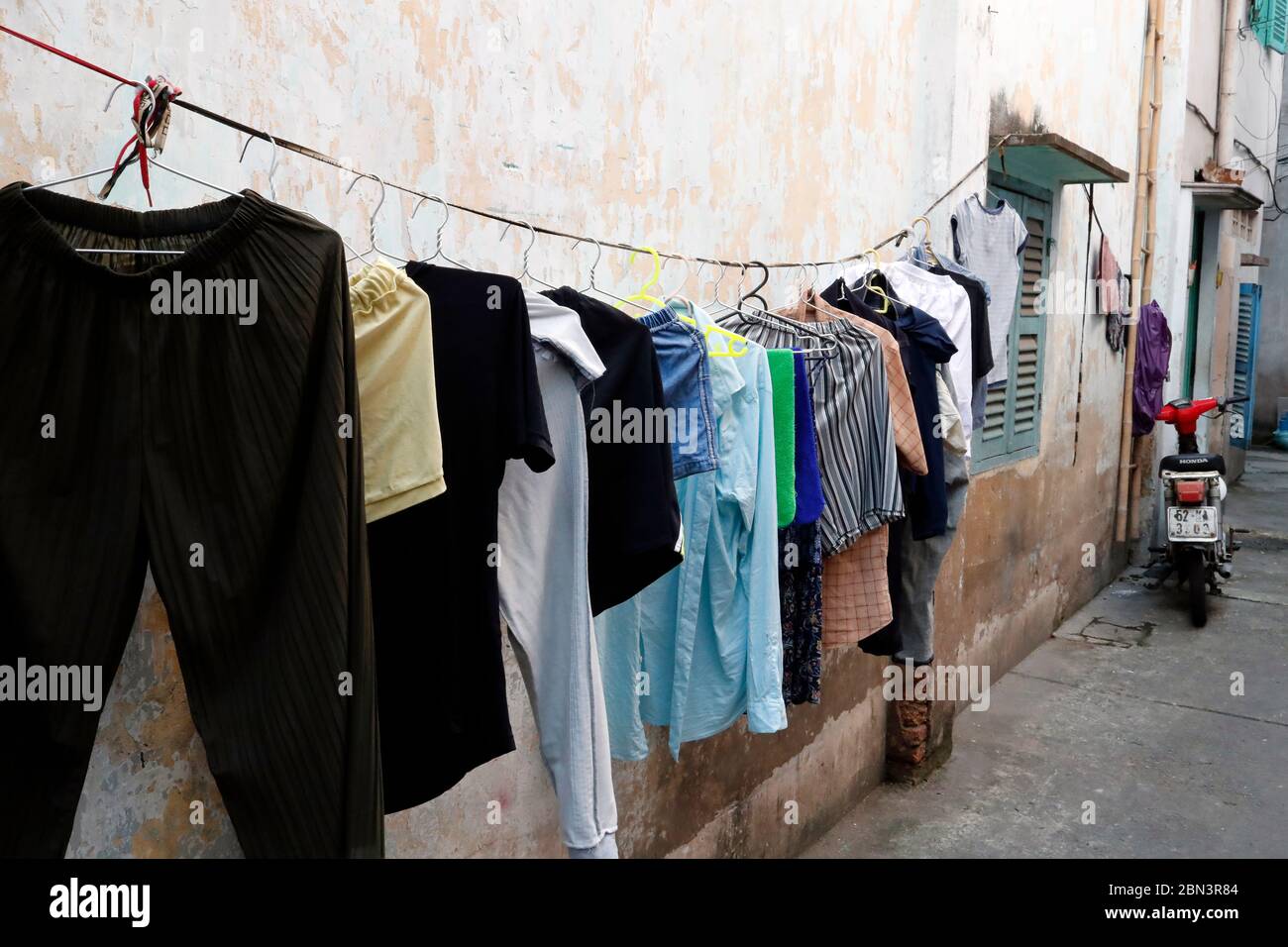 Chinese district of Cholon. Laundry drying in the street. Vietnam Stock ...