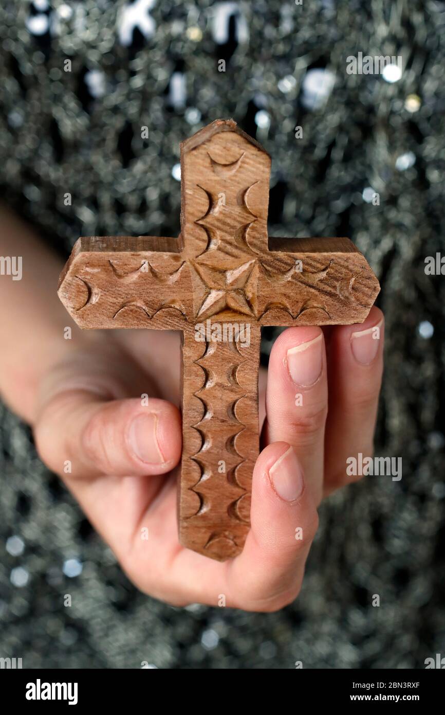 Christian woman with cross Stock Photo - Alamy