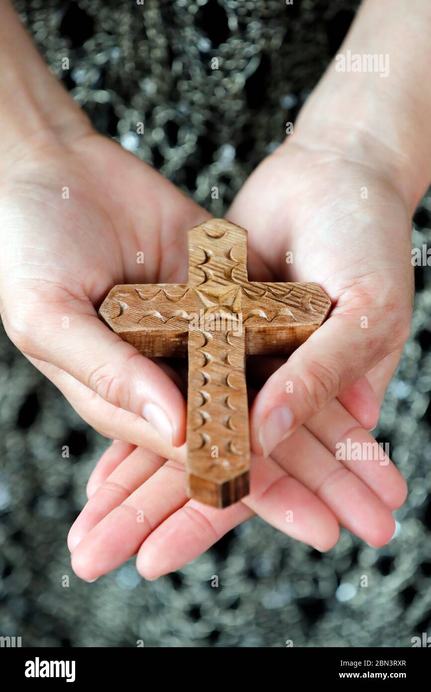 Christian woman with cross Stock Photo - Alamy