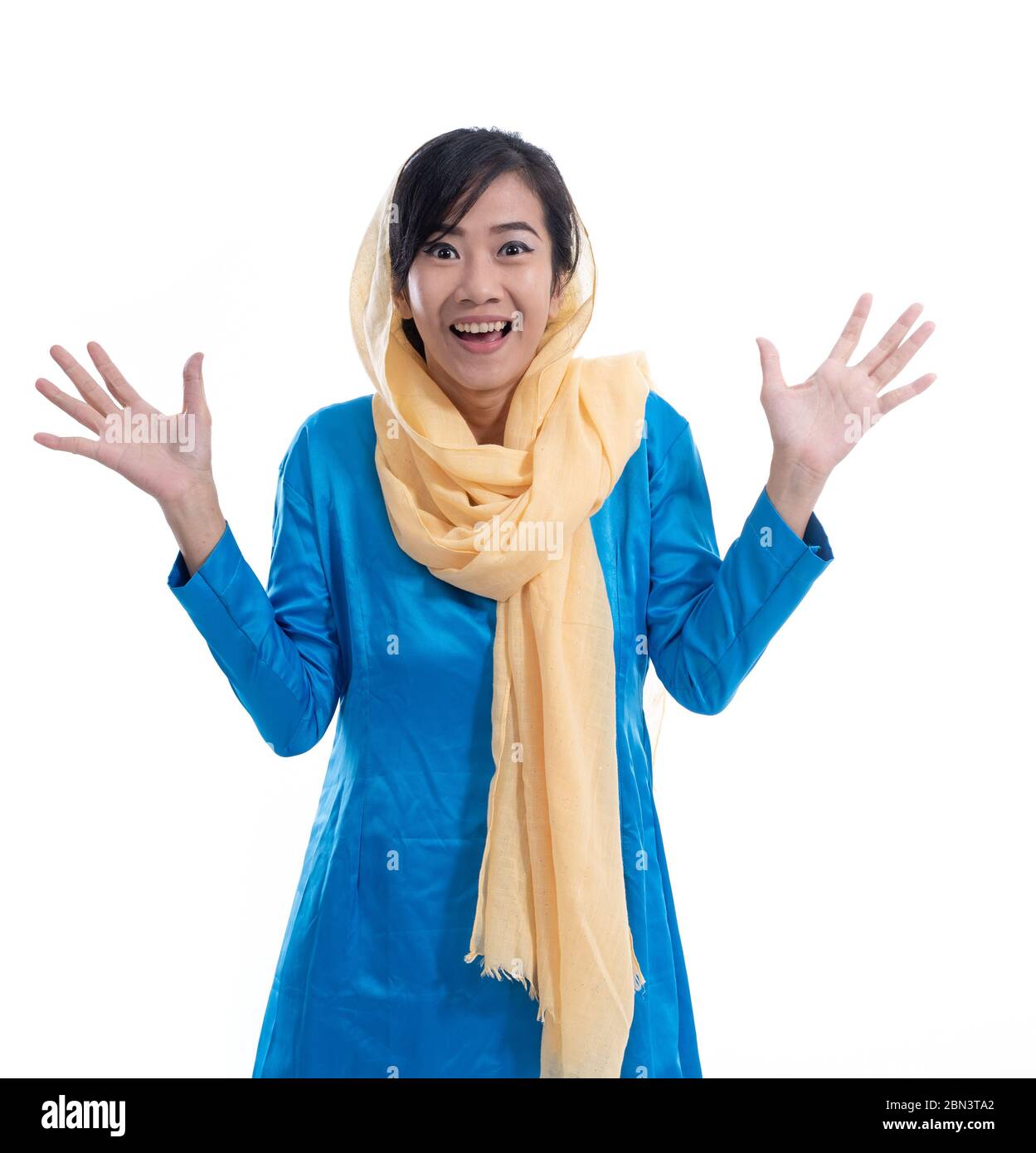 happy excited muslim woman over white background Stock Photo - Alamy