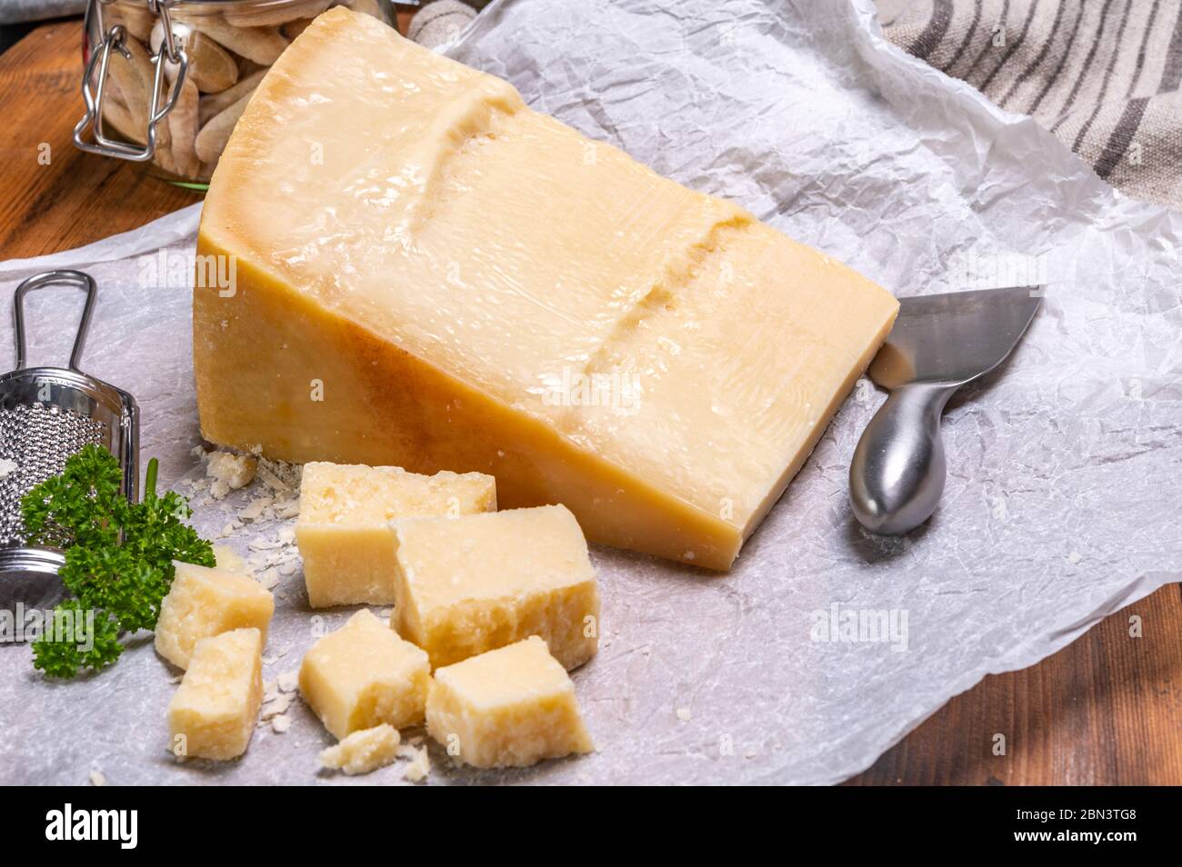 Big wedge of parmigiano-reggiano parmesan hard Italian cheese made from ...
