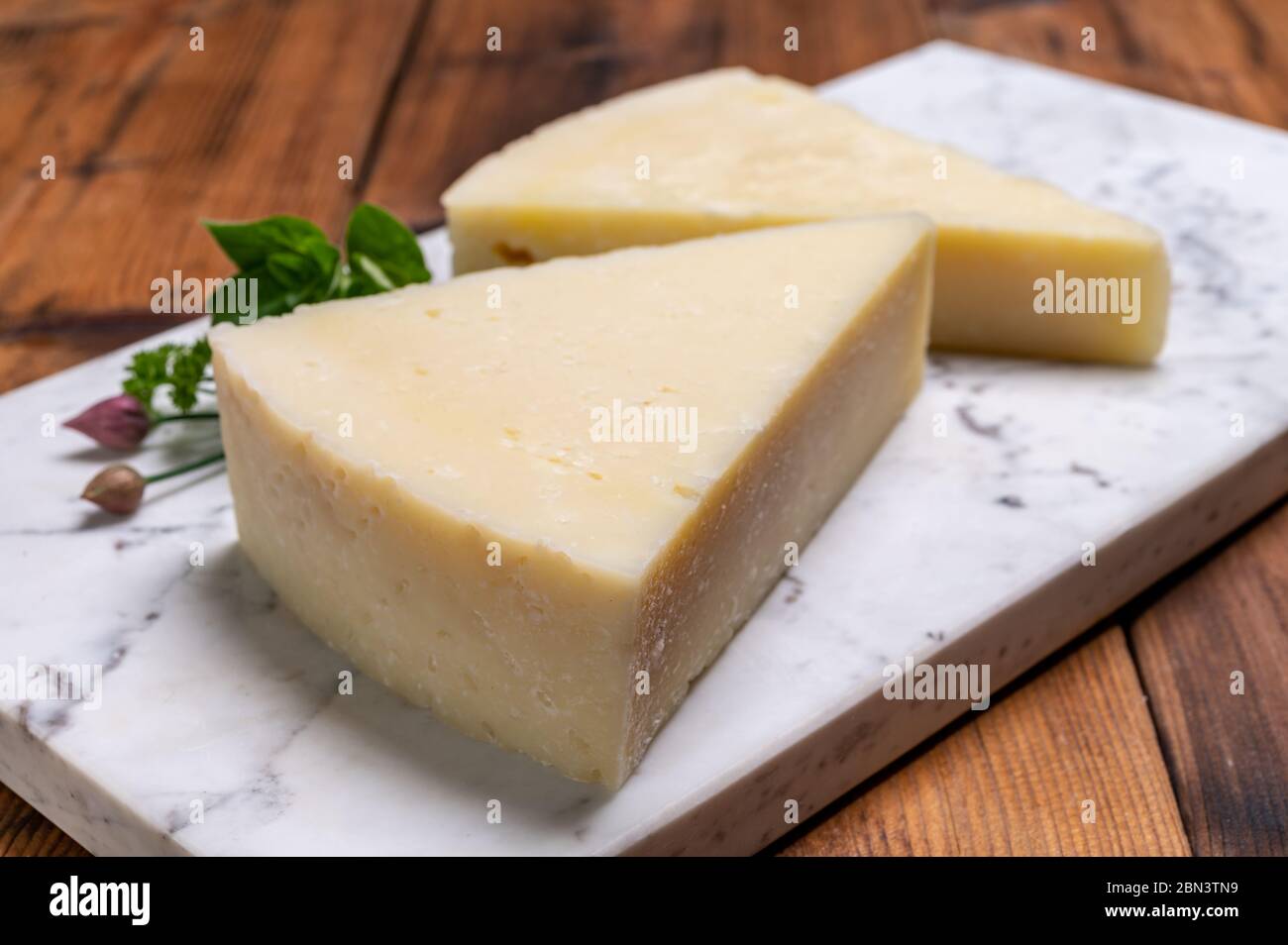 Pieces of matured pecorino romano italian cheese made from sheep milk ...