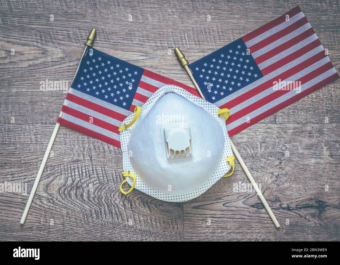 Concept. Two mini American flags and N95 Mask Stock Photo - Alamy