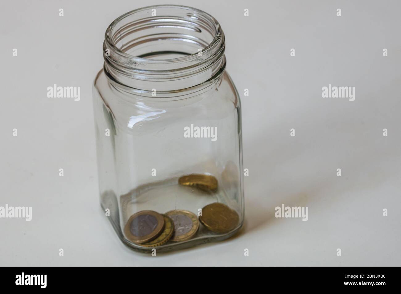 Composition with saving money coins in a glass jar. Concept of ...