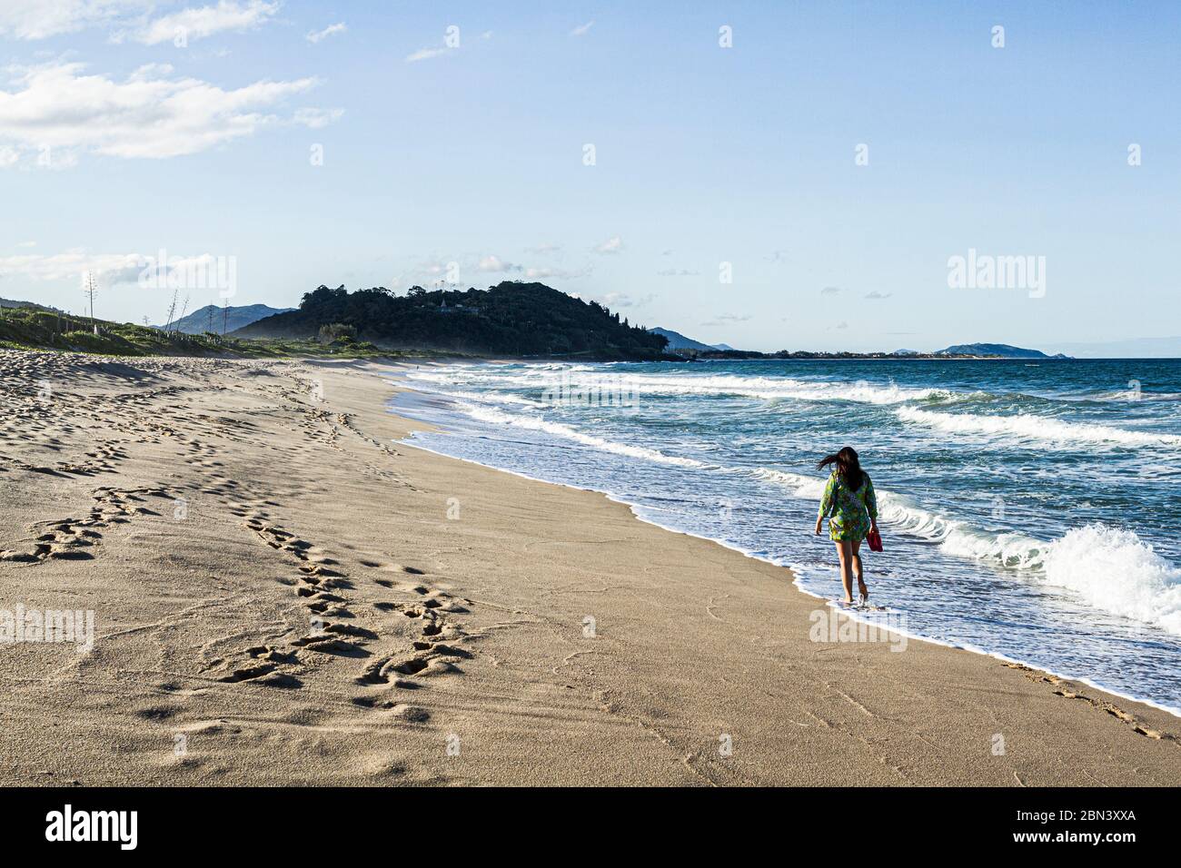 Woman walking at Armacao Beach. Florianopolis, Santa Catarina, Brazil ...