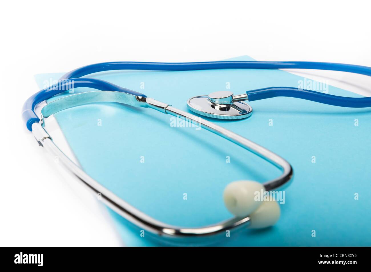 medical record and blue stethoscope close-up on white background in ...