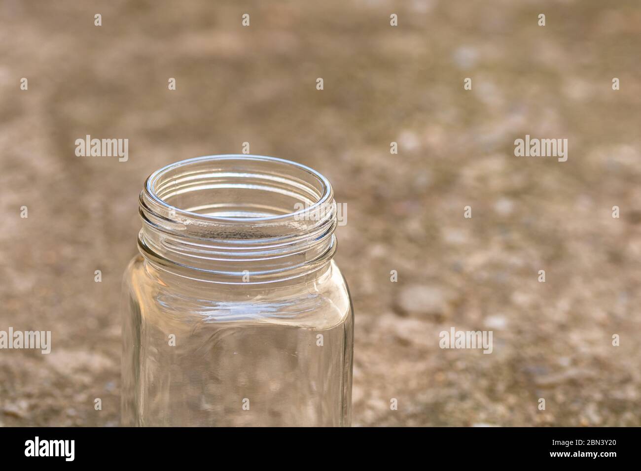 Close up of empty glass jar isolated Stock Photo - Alamy