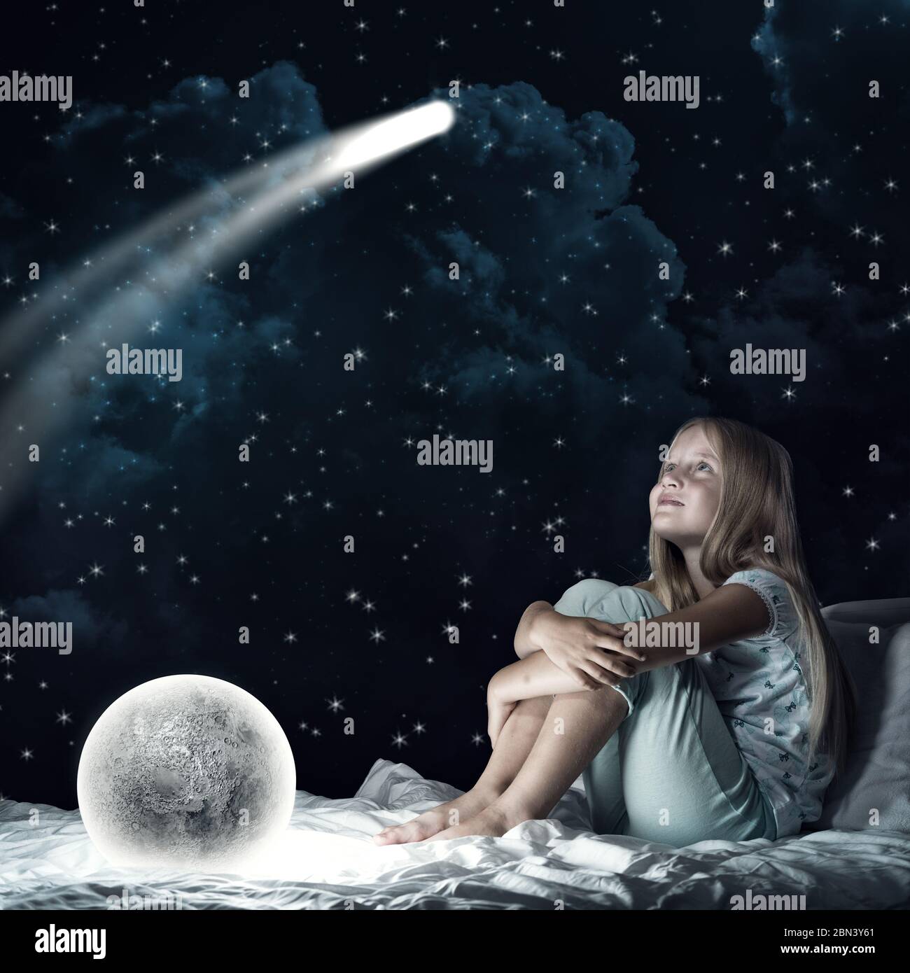 Girl in her bed and moon planet Stock Photo - Alamy