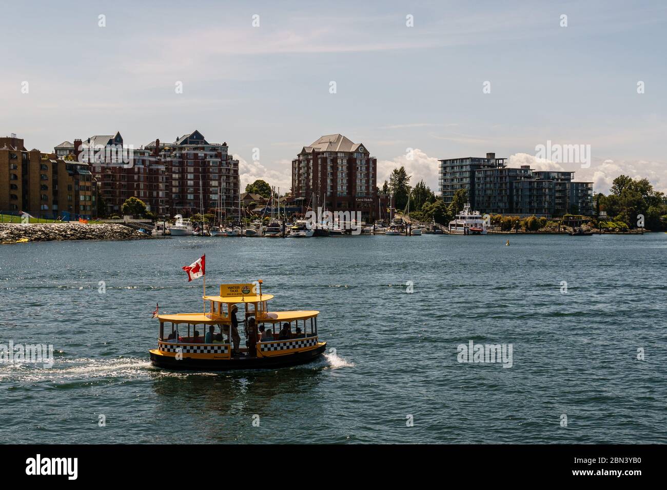 VICTORIA, CANADA - JULY 14, 2019: green sea bus in busy harbor at ...