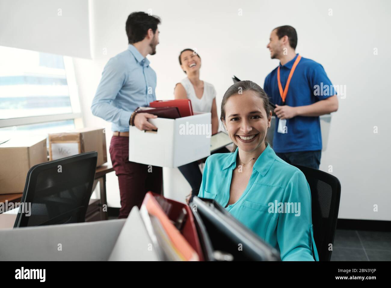 Business People Moving Into New Office Unpacking Boxes Stock Photo - Alamy