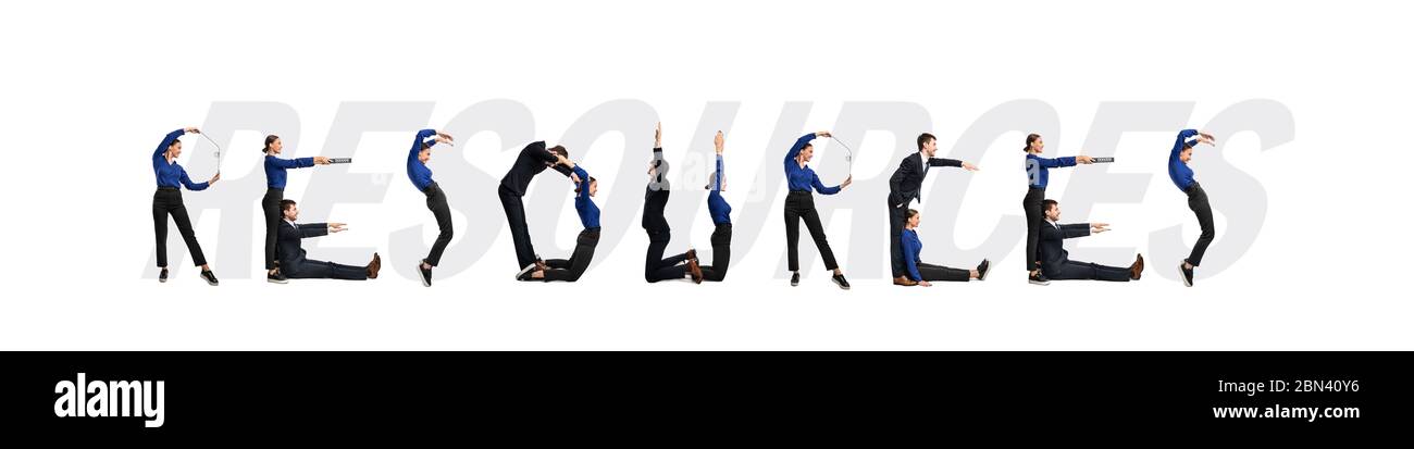 Group of people forming resources word at studio Stock Photo - Alamy