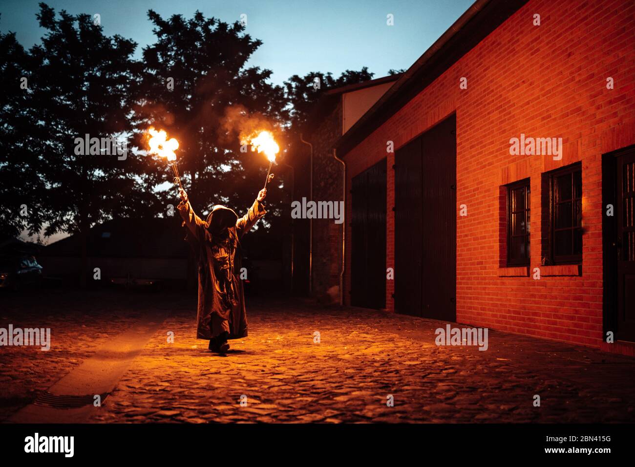 photo of a fire show performer playing with fire Stock Photo - Alamy