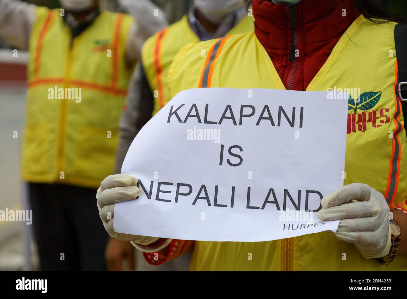 Kathmandu, Nepal. 12th May, 2020. A Human Rights Activist holds ...