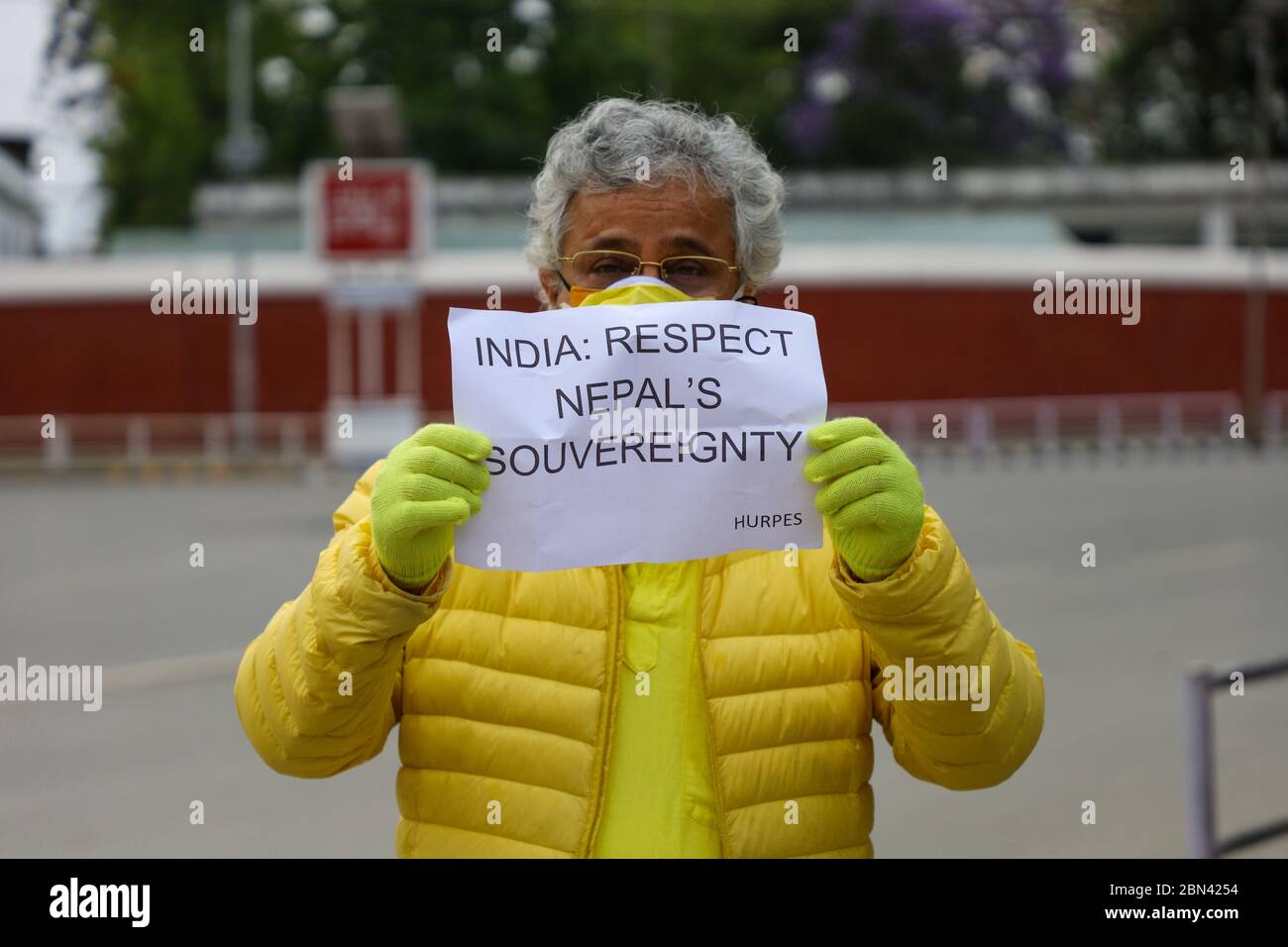 Kathmandu, Nepal. 12th May, 2020. Human Rights Activists holds playcard ...