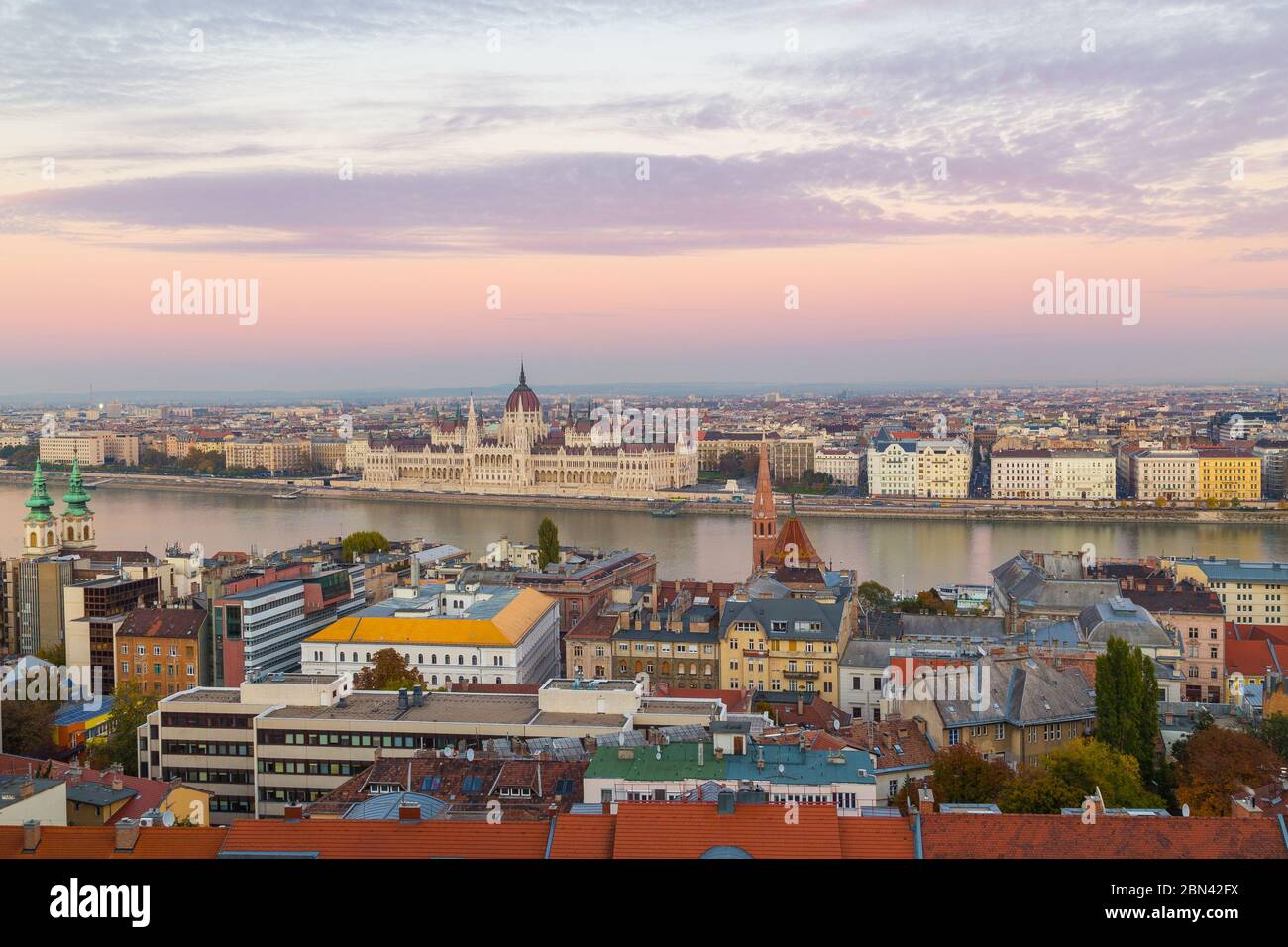 A high view of the Hungarian Parliament and Budapest skyline at sunset ...