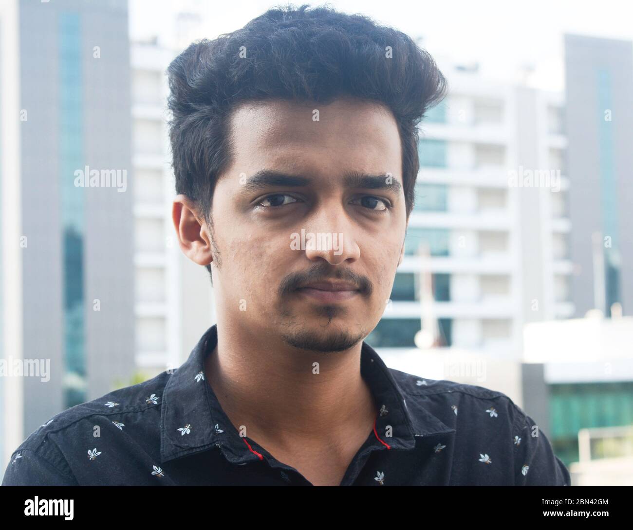 Simple portrait of young man , looking straight at the camera Stock ...
