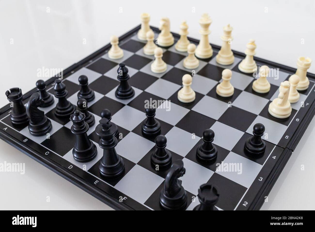 A typical chess set, showing the various pieces on the board Stock ...