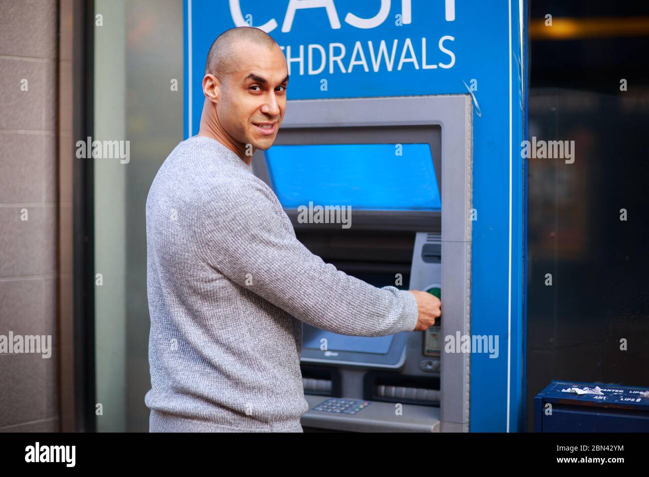 Male withdrawing cash at atm hi-res stock photography and images - Alamy
