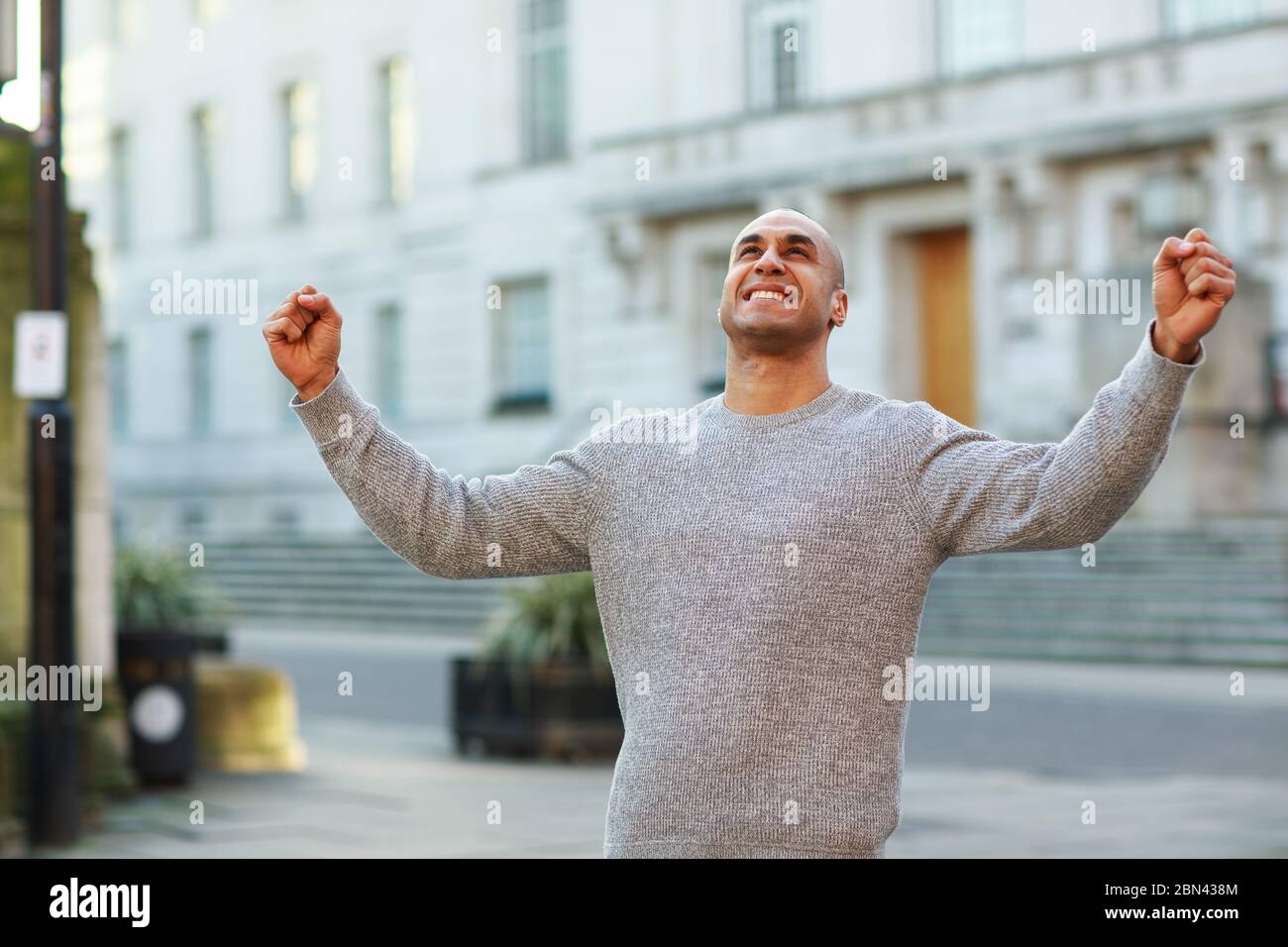 happy man in the street celebrating Stock Photo - Alamy