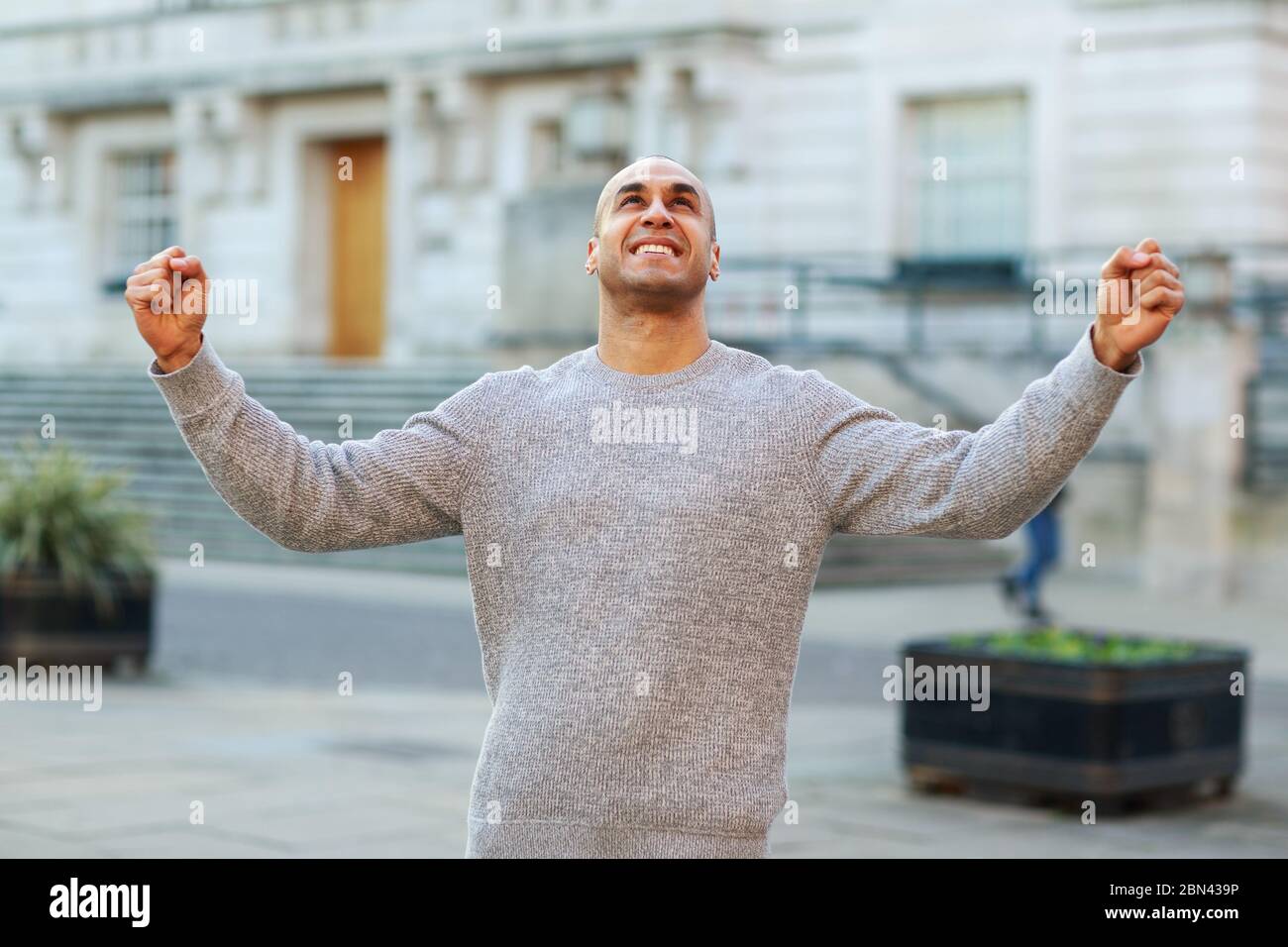 happy man in the street celebrating Stock Photo - Alamy