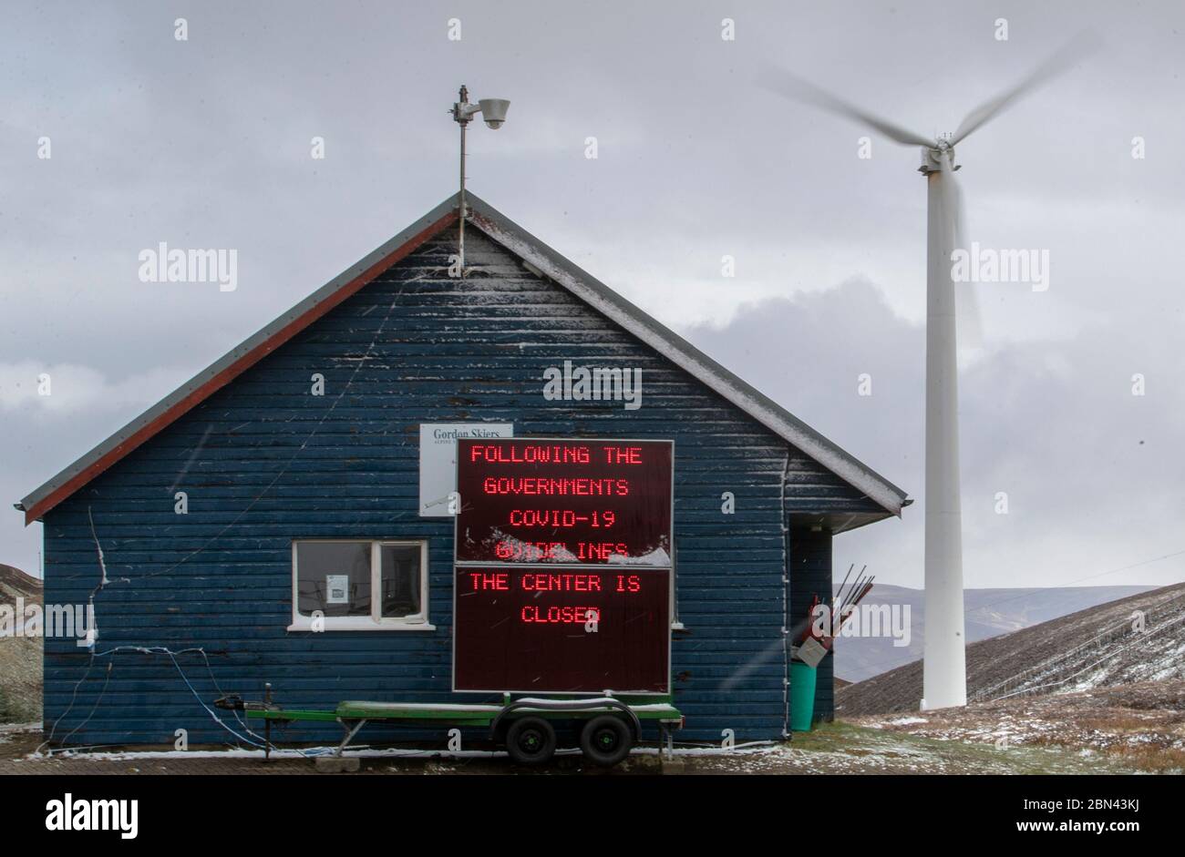Snow-covered information sign at the Lecht Ski Centre in Aberdeenshire ...