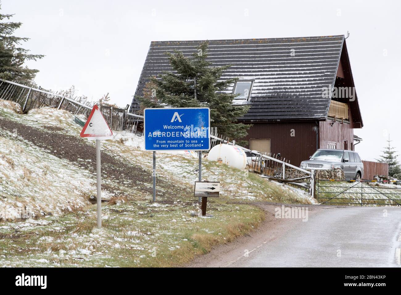 Snow alongside the A939 at the Lecht Ski Centre in Aberdeenshire as ...
