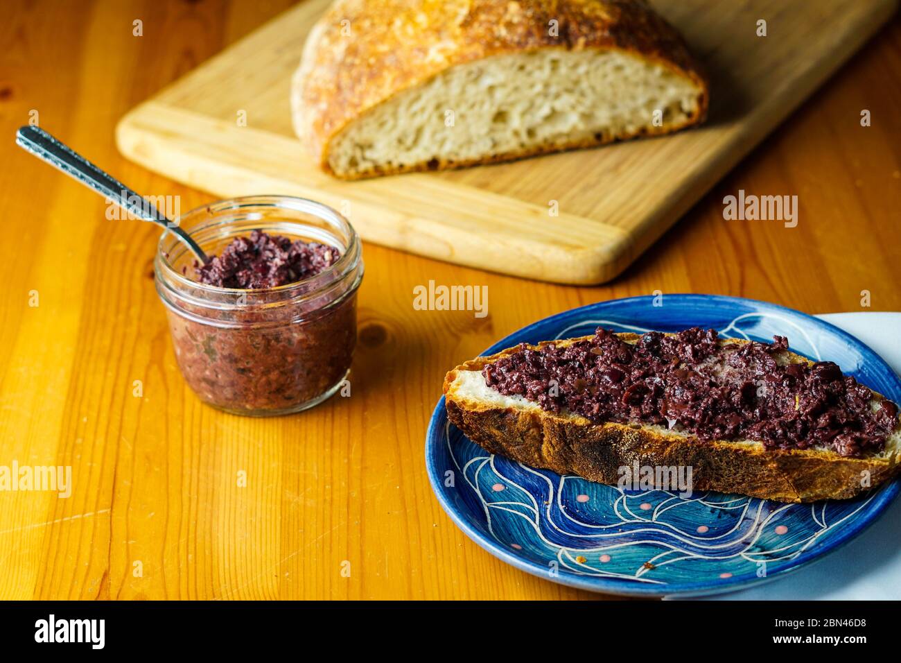 Fresh bread with olive tapenade Stock Photo - Alamy