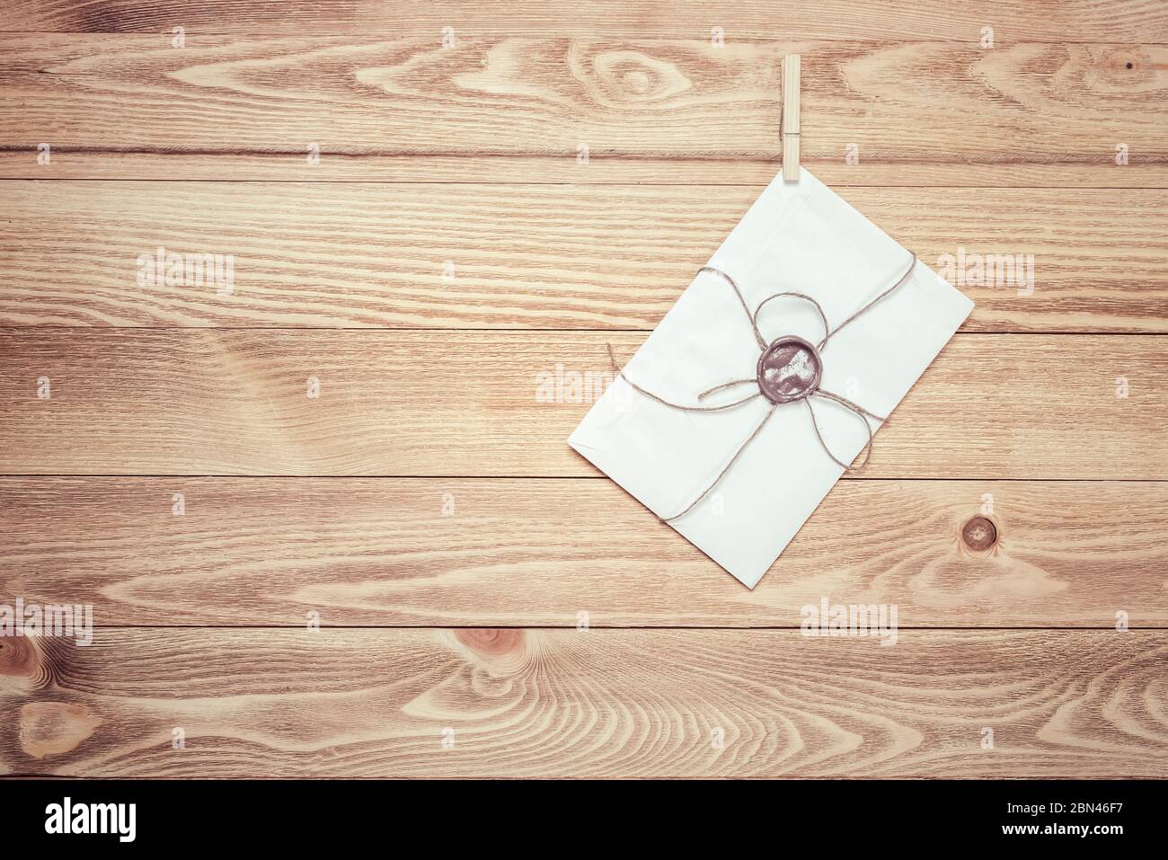 Mail envelope on rope Stock Photo - Alamy