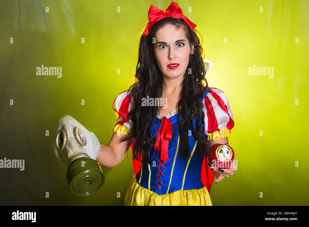 Woman holding hazardous radioactive apple. Nuclear and radiation ...
