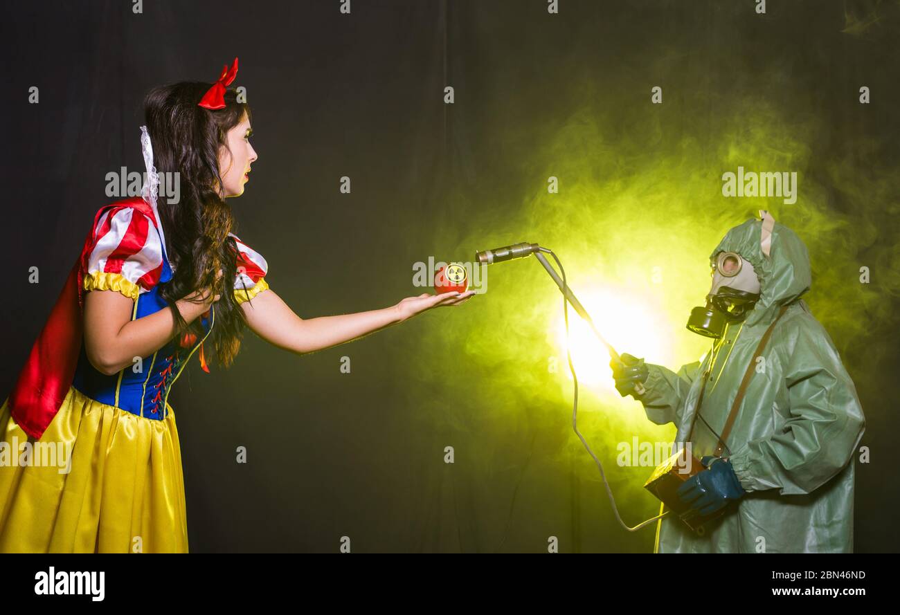 Woman dressed as fairytale character holds Radioactive atomic nuclear ...