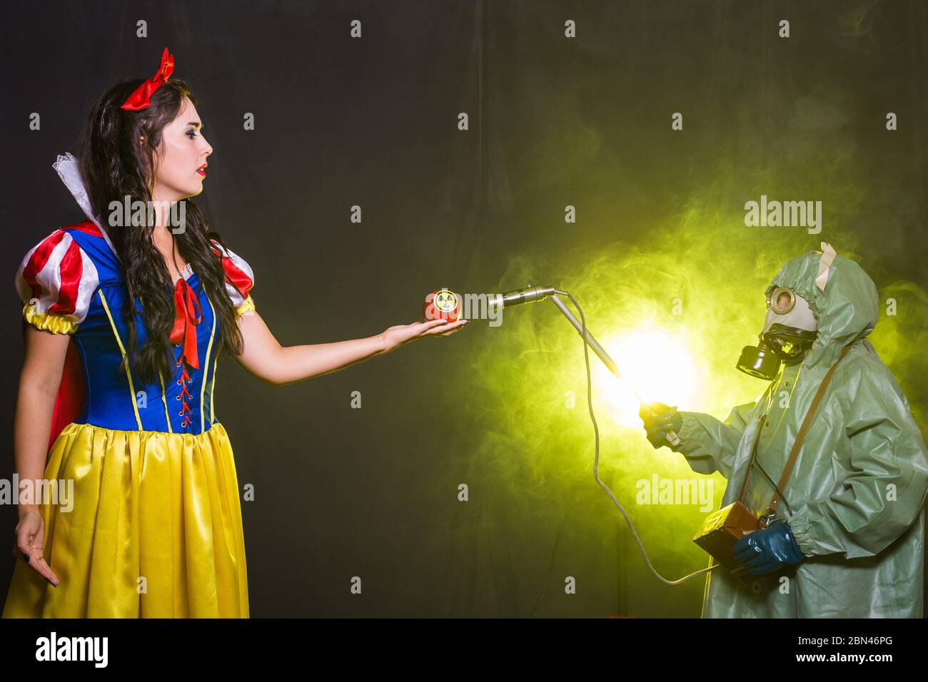 Woman holding hazardous radioactive apple. Nuclear and radiation ...