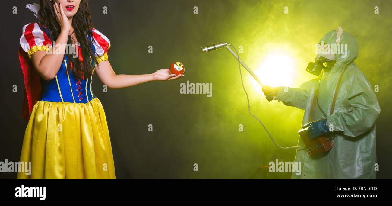 Woman holding hazardous radioactive apple. Nuclear and radiation ...