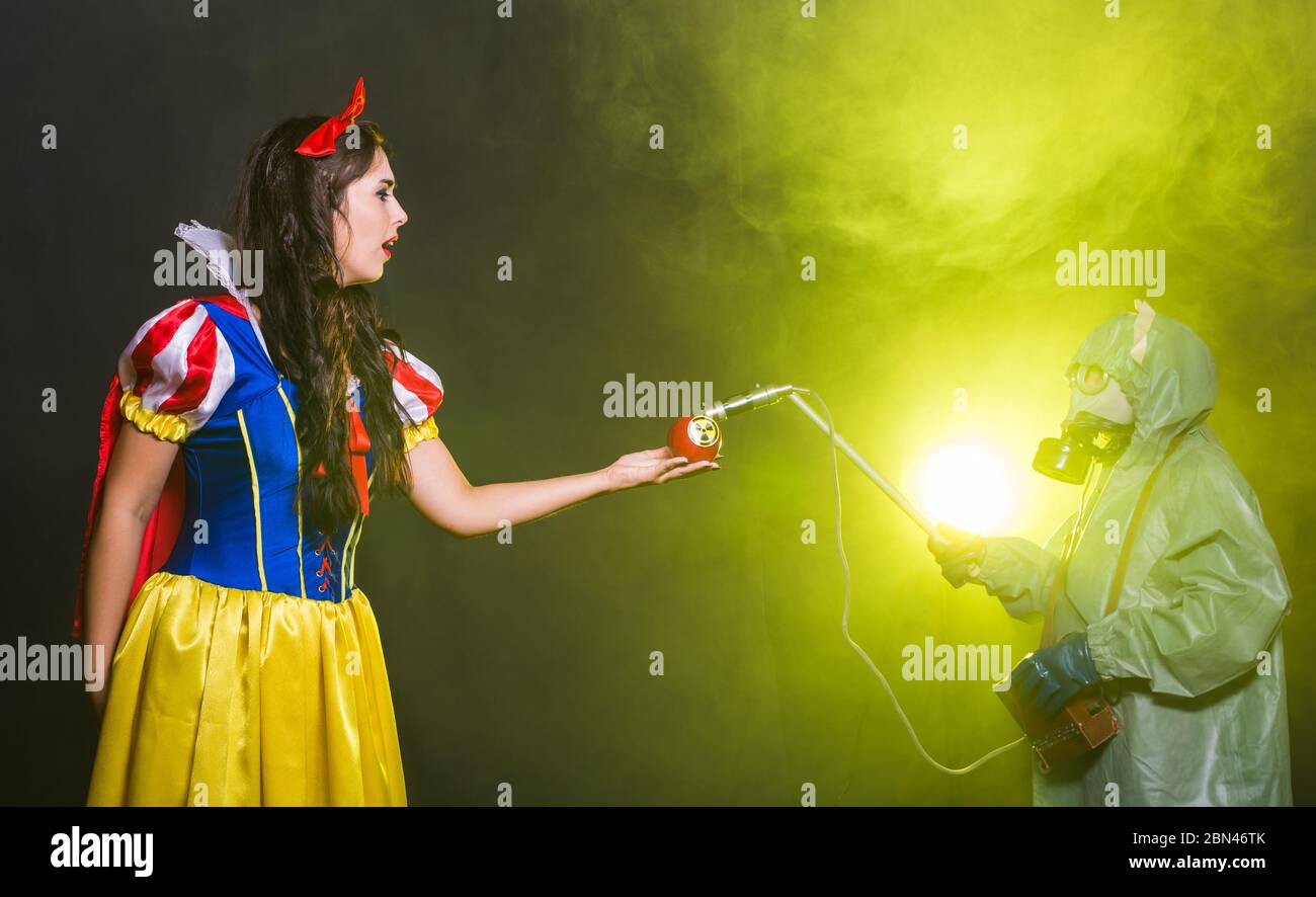 Woman holding hazardous radioactive apple. Nuclear and radiation ...