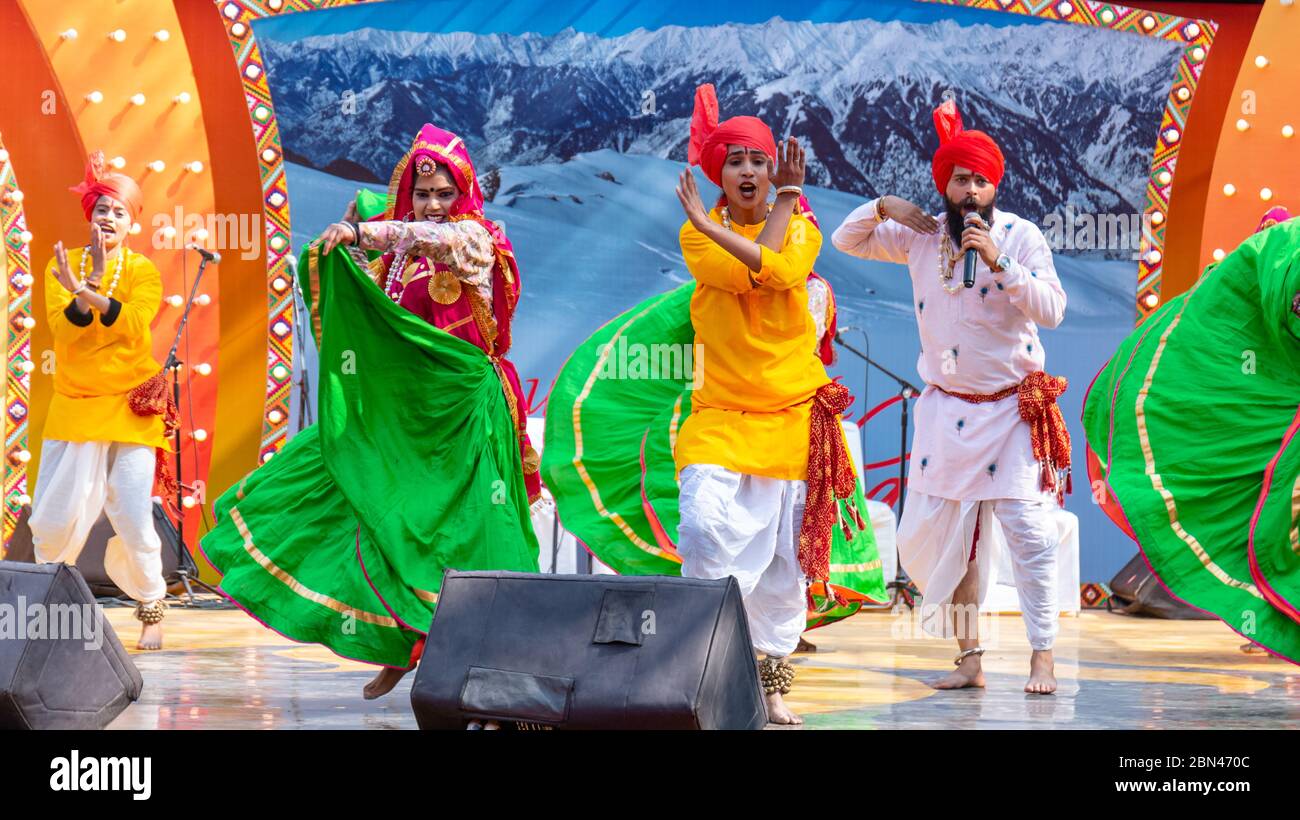 Young Indian Male and Female dancers performing regional/folk dance in ...