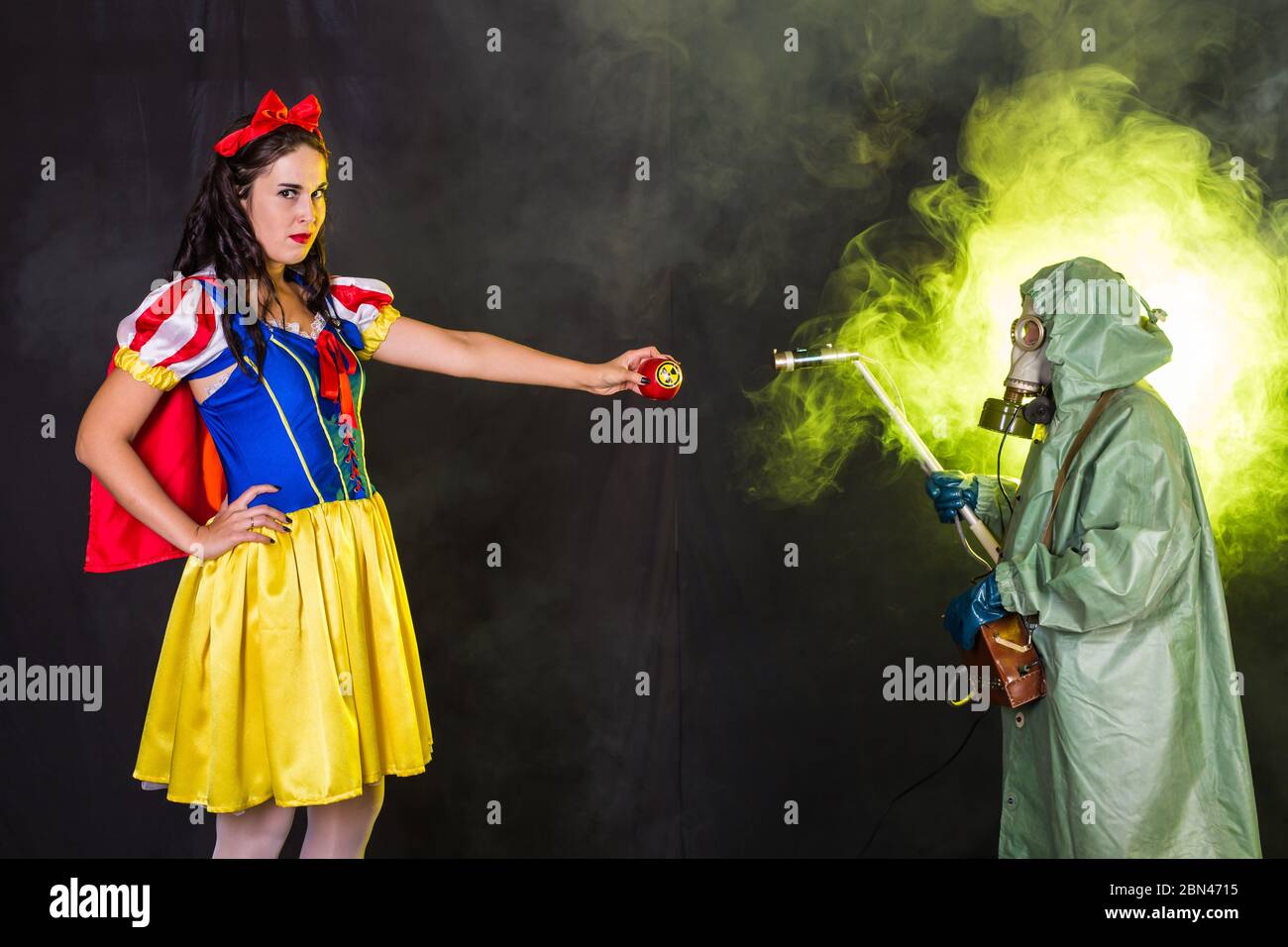 Woman holding hazardous radioactive apple. Nuclear and radiation ...