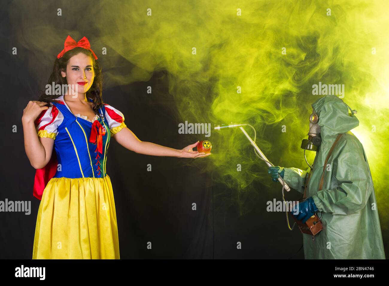 Woman holding hazardous radioactive apple. Nuclear and radiation ...